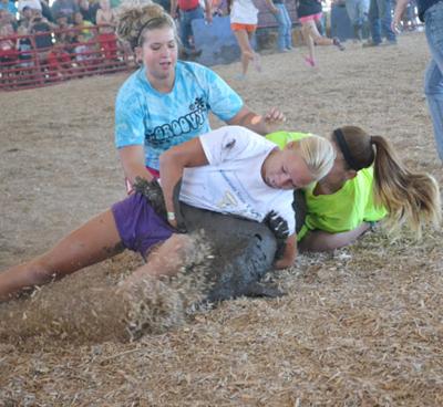 Greased pig contest makes them run
