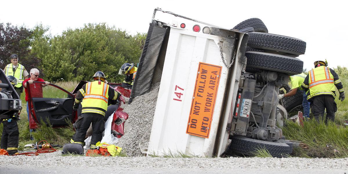 1 killed in dump truck, car crash
