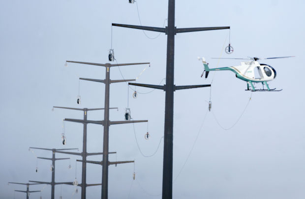 ITC strings cables between transmission line poles