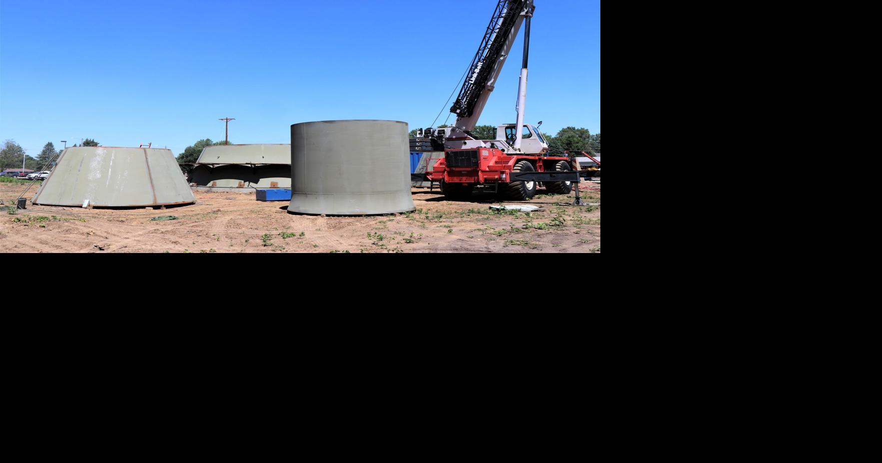 Water tower slowly rises above Osage