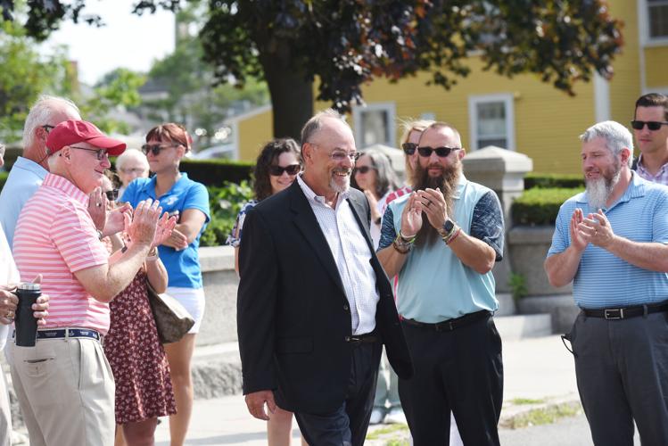 Affordable housing beam signing honors past Y CEO | Business ...