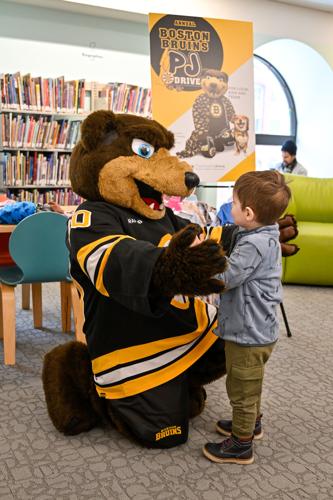 Bruins fans score at PJ Drive: Mascot Blades hands out pucks, hugs ...