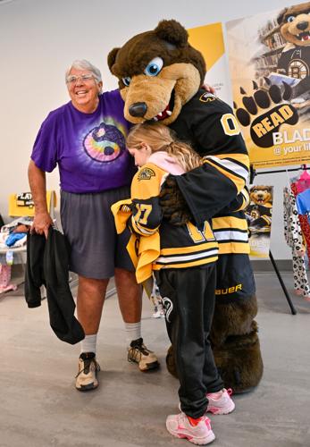 Bruins fans score at PJ Drive: Mascot Blades hands out pucks, hugs ...