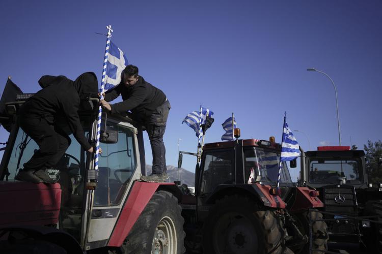Farmers drive tractors through Paris and block highways in Greece to ...