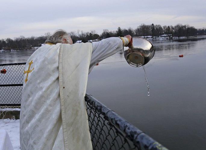 St. Mary’s Orthodox Church members perform ceremony at Goshen Dam Pond ...