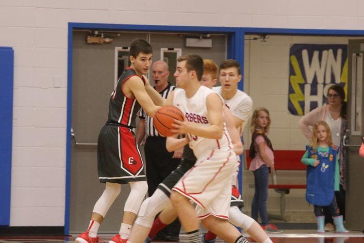BOYS BASKETBALL: Rocking Robinson leads Goshen past West Noble | Local ...