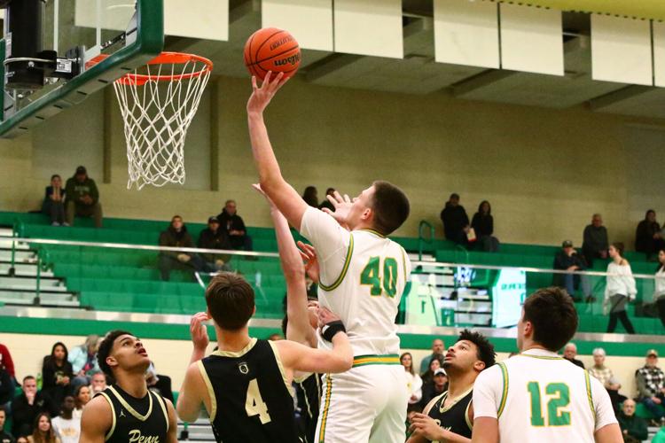 PREP BOYS BASKETBALL: Scholl shoulders the load in No. 8 Raiders run ...