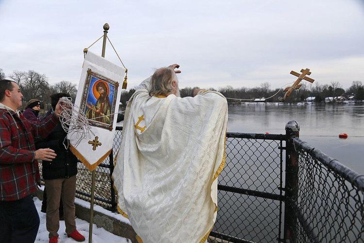 St. Mary’s Orthodox Church members perform ceremony at Goshen Dam Pond ...