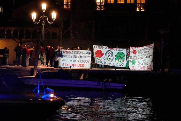 Olympic flame glides on traditional Venetian boats down the Grand Canal ...