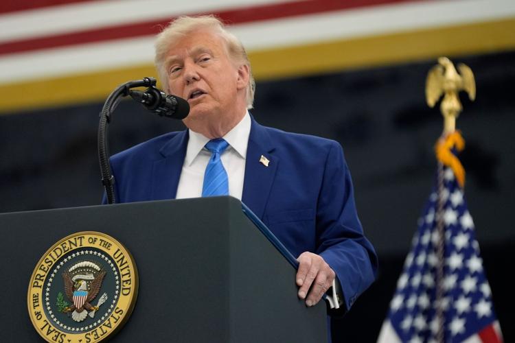 President Donald Trump unveils the new Air Force One, a converted ...