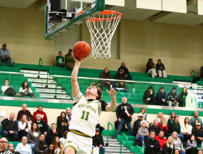 PREP BOYS BASKETBALL: Scholl shoulders the load in No. 8 Raiders run ...