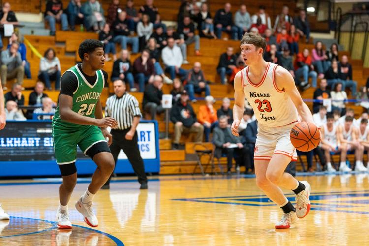 PREP BOYS BASKETBALL: Concord hangs tough, falls to Warsaw in 4A ...