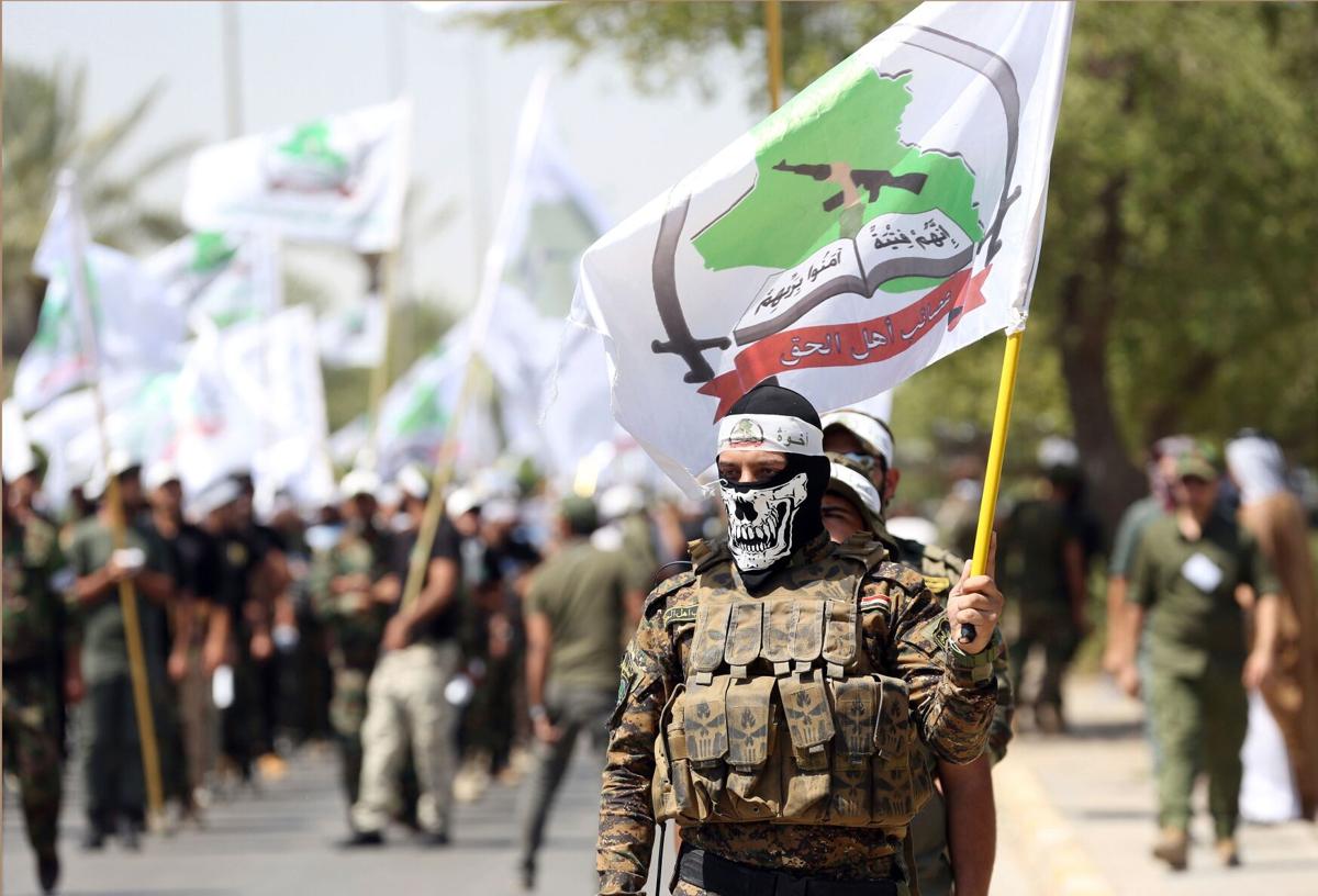 Powerful Iran-backed Iraqi militia says it will start handing its ...