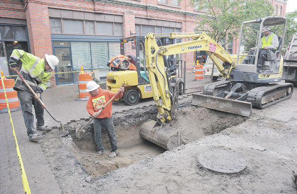 Crews work to move electrical, telecommunications lines underground ...