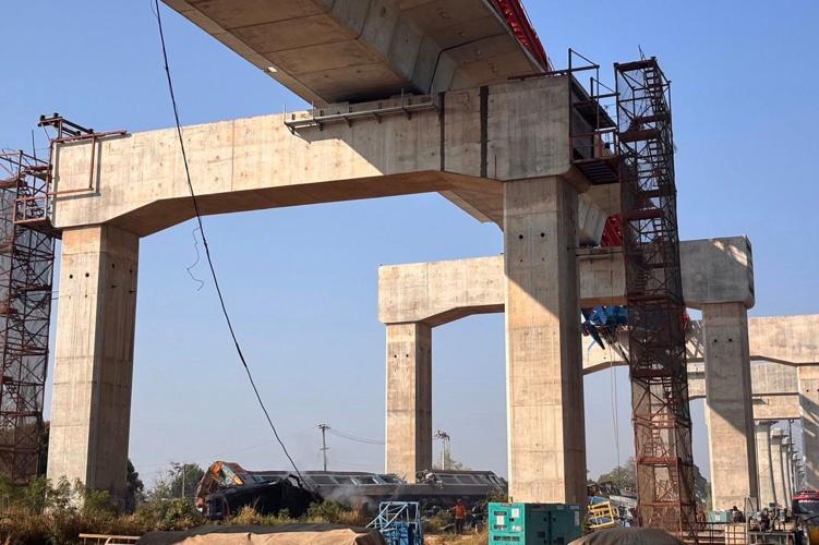 A construction crane falls onto a moving train in Thailand, killing at ...
