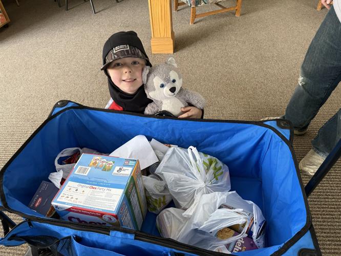 Cub Scouts brave chilly weather to collect food shelf donations | Food ...