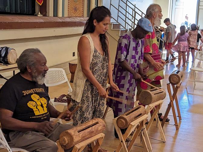Students learn about traditional African drumming at library event ...