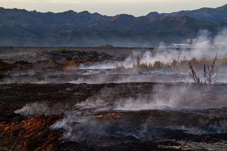 Hazy skies clear as firefighters make progress at wildlife refuge burn ...