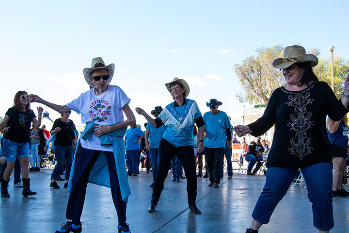 Students get in on fun during line dance event on the London Bridge ...