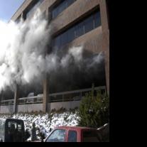 Truck fire in parking garage forces evacuation of building