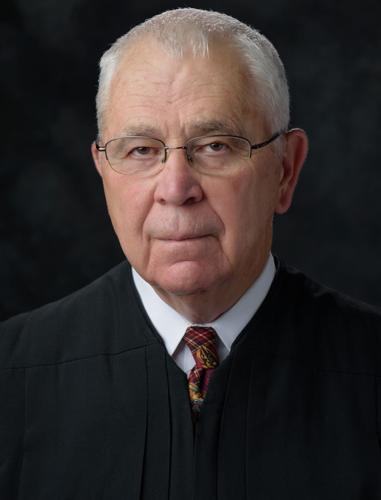 Former federal judge in Helena reaches settlement in crash