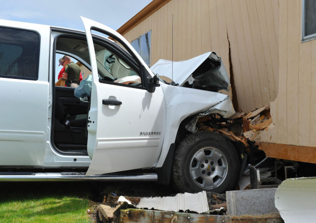 Truck runs into house in Helena Valley