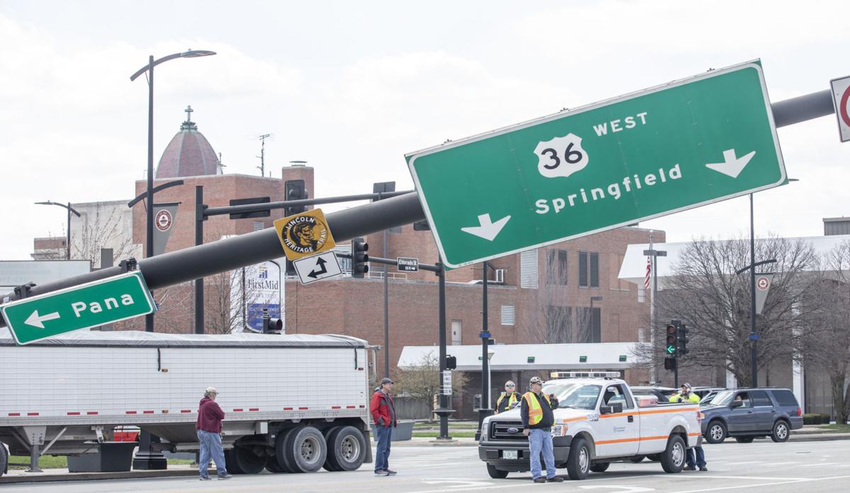 PHOTOS: Truck hits pole, IDOT sign blocks downtown Decatur street