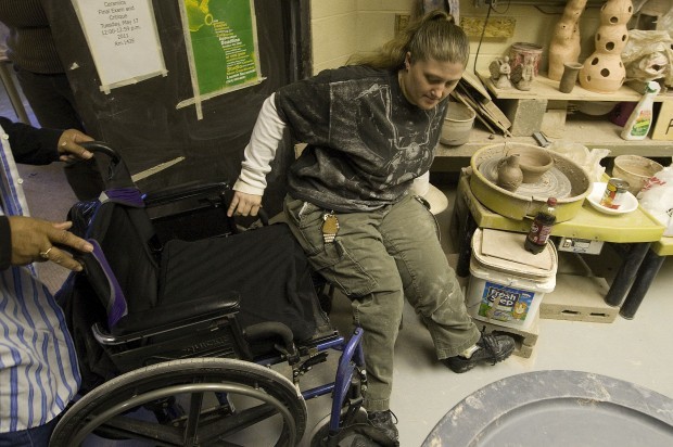 Ceramics class rigs up unusable potter's wheel for wheelchair student