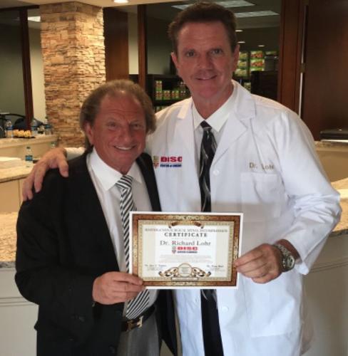 Dr. Lohr receives masters certificate for back pain treatment