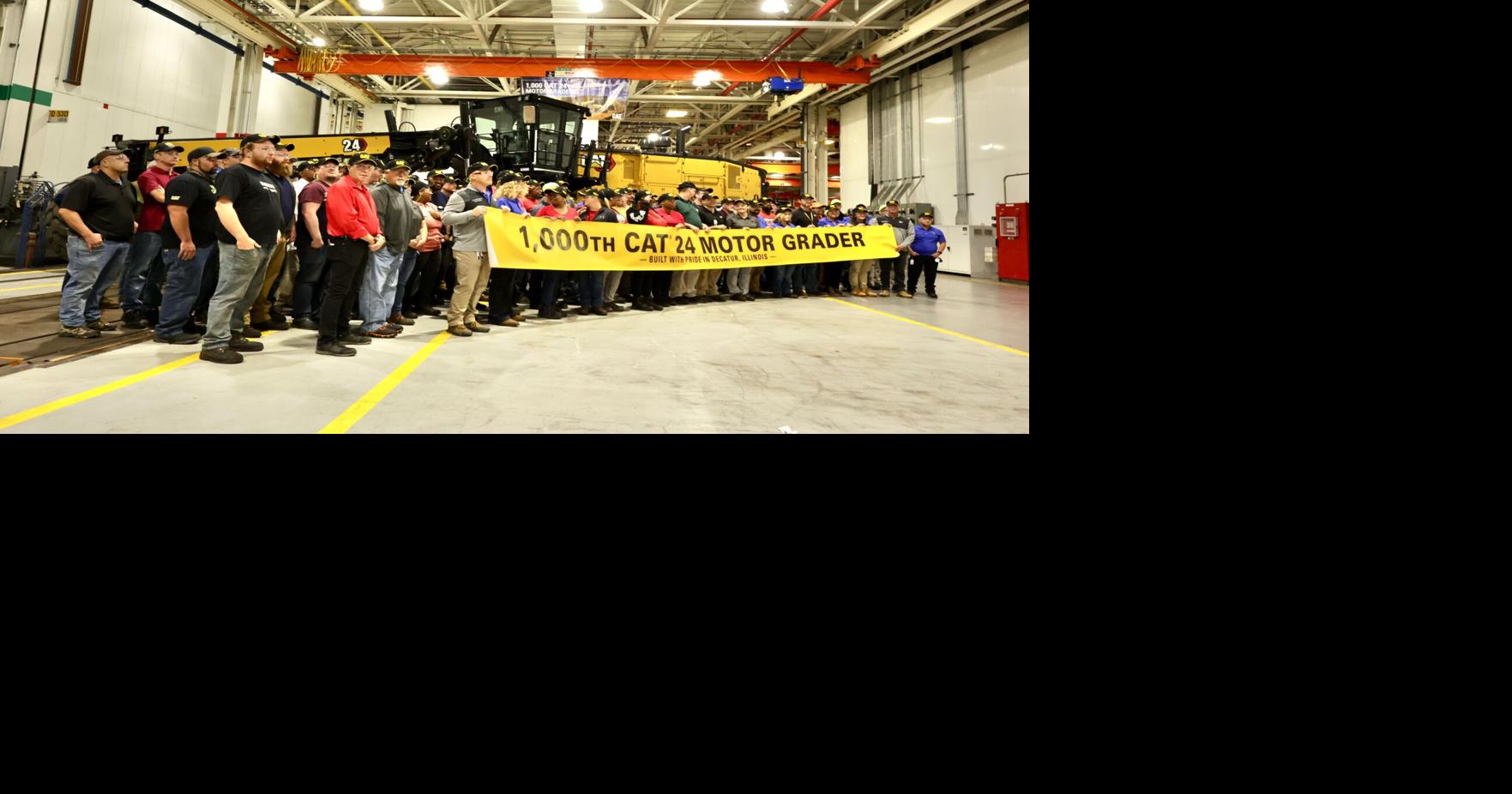 Decatur CAT employees celebrate motor grader milestone