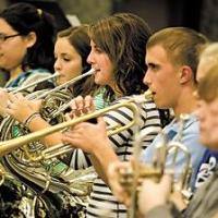Decatur Youth Symphony Orchestra baton being passed to members
