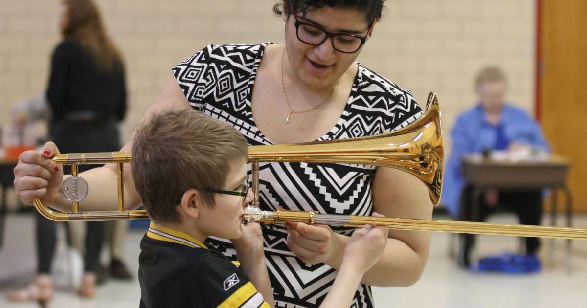 Students take note of instrument petting zoo