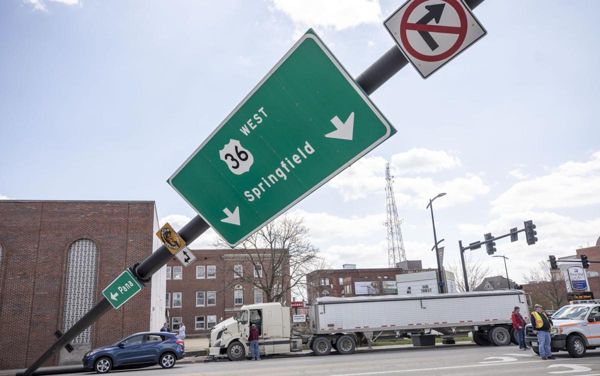 PHOTOS: Truck hits pole, IDOT sign blocks downtown Decatur street