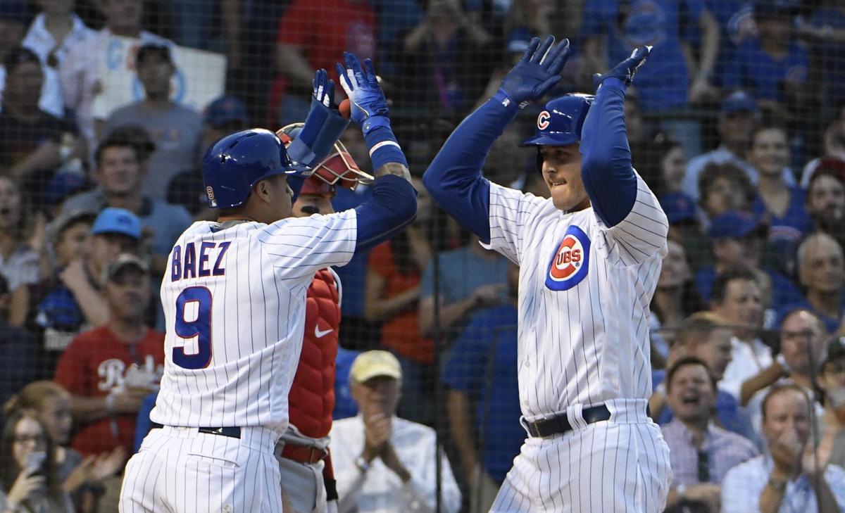 Hamels goes distance, Cubs beat Reds
