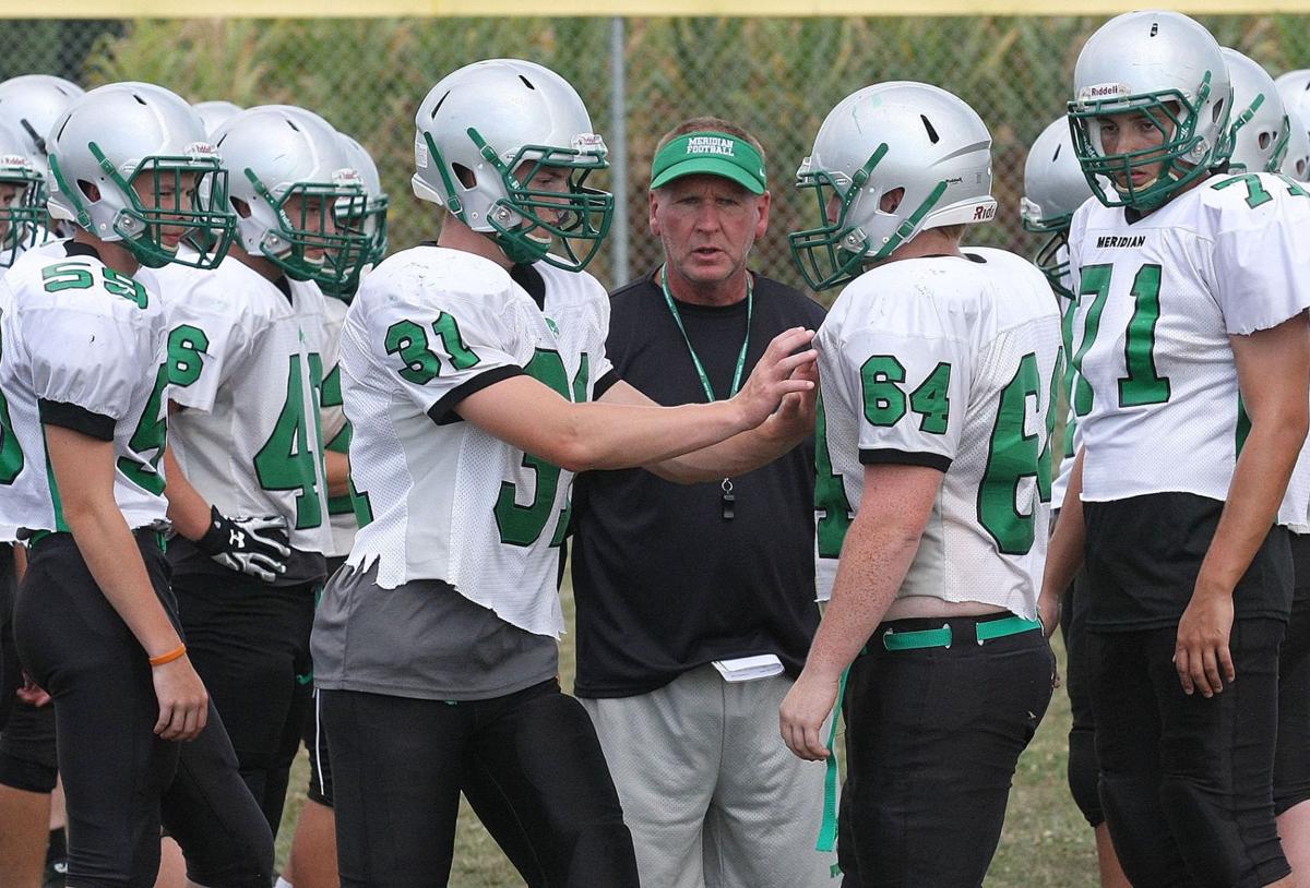 Scott Davis helping MacArthur