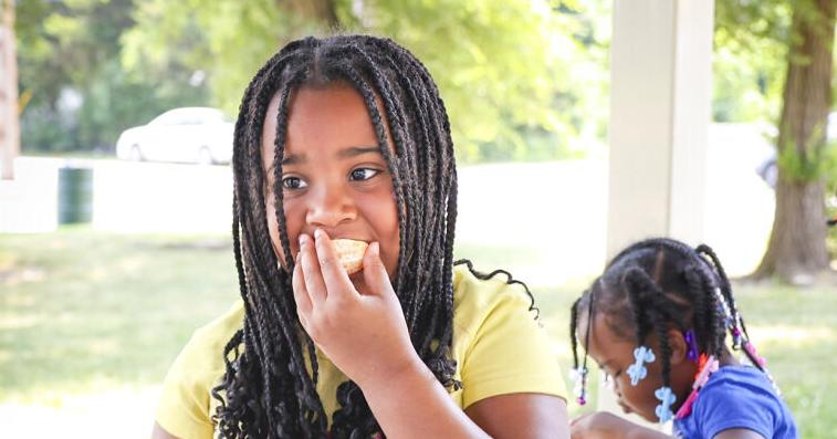 Decatur Park District yellow hat park leaders serve lunches