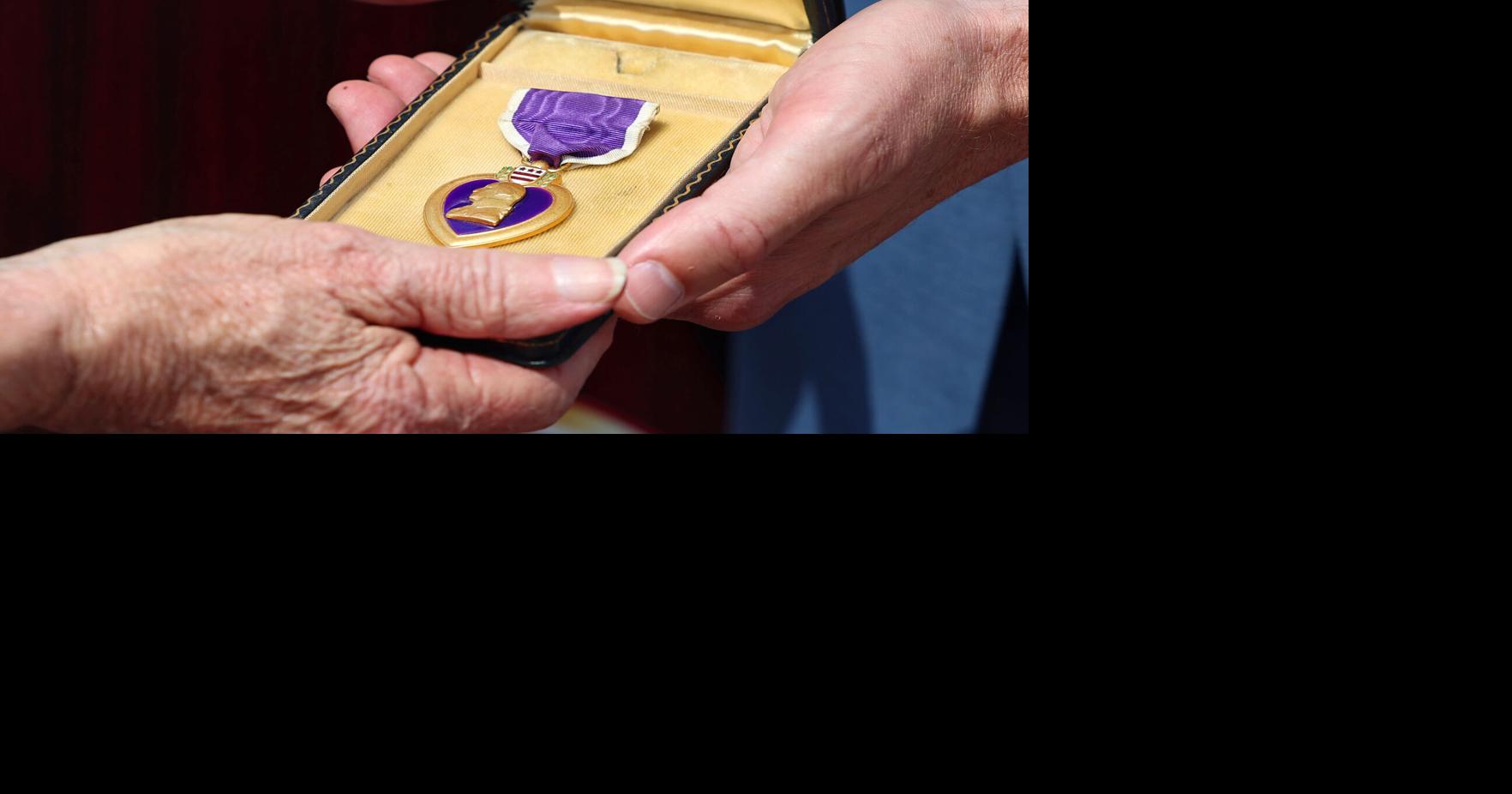 Family of John L. Moore accepts Purple Heart in Decatur