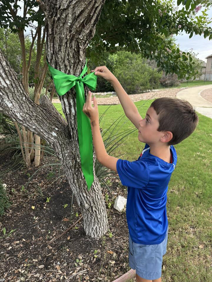 TIES THAT BIND: New Braunfels rallies behind the green ribbon movement for Hill Country flood ...