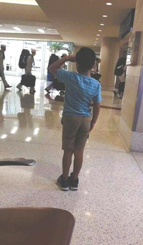 Photo of NB boy saluting sailors at airport goes viral | News | herald ...