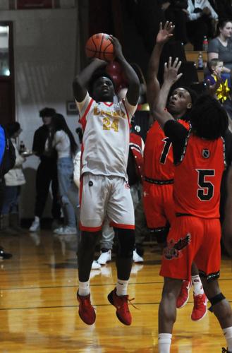 Liberty Christian players run laps after rolling to 20-point home win ...