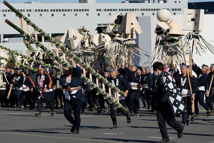 Photos show ladder stunts and other activities at a Tokyo fire brigade ...