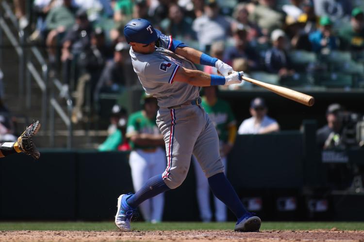 Rangers rally for 4 runs in the 9th inning to beat the Athletics 9-6 ...