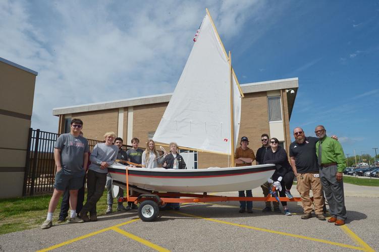 Lakeshore High School woodworking class names boat after student ...