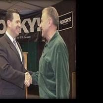 ANDREW "ROCKY" RACZKOWSKI shakes the hand of Frank Jackson of Sodus ...
