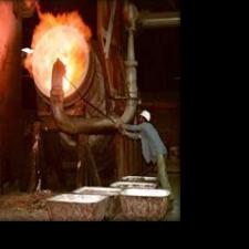 Robert Armes adjusts the direction of the flame at one of two furnaces ...