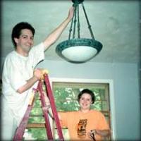 Keith and Laura Merle of St. Joseph put some finishing touches on their ...