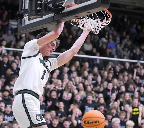 Prep boys basketball: Wolves capture region title with blowout of ...