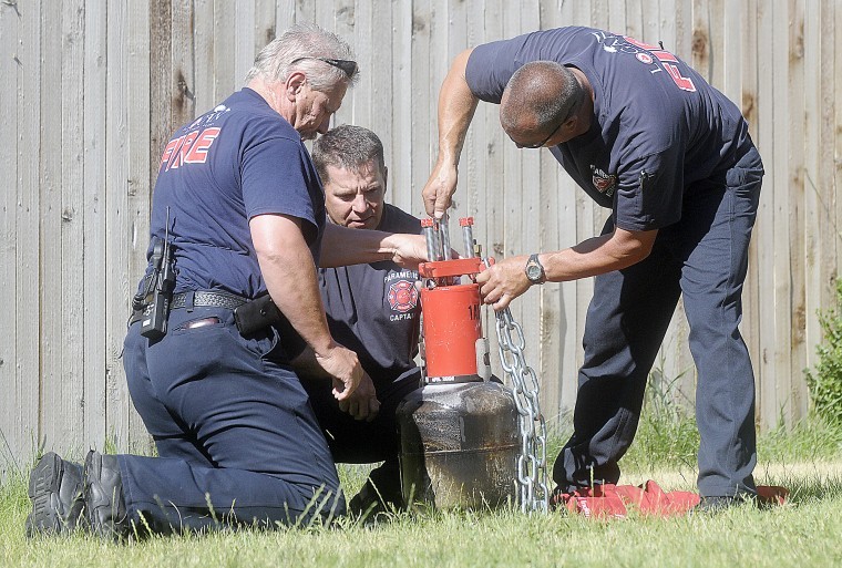 Neighbors fight blaze: Exploding propane tank causes Logan deck fire ...