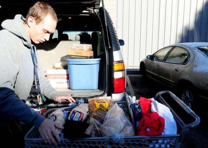 Community members of various faiths volunteer at Logan food pantry ...