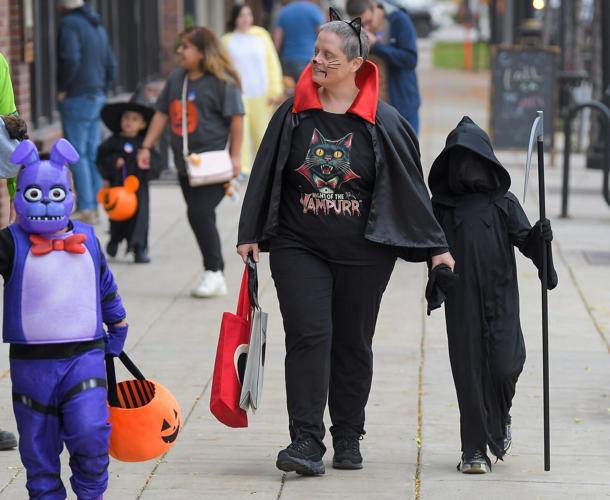 Downtown Logan’s sidewalks bustle with trick-or-treaters on Halloween ...